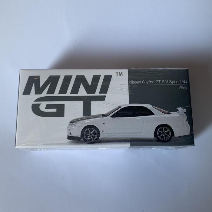Jual Mini gt Nissan skyline gt r34 spec II N 1 (White & Carbon) - Kota ...
