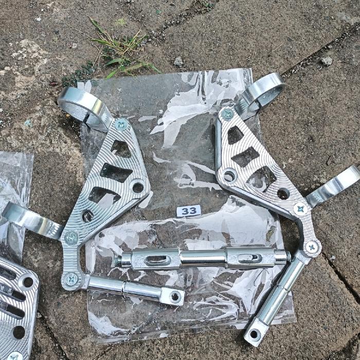 Jual breket kupingan lampu depan pnp shok depan ninja R Rr Scorpio ...